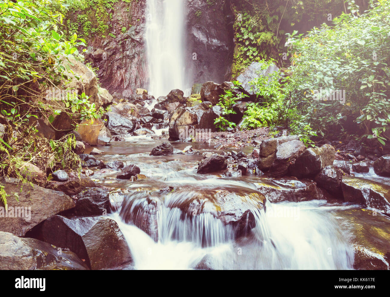 Waterfall in Indonesian jungle Stock Photo - Alamy