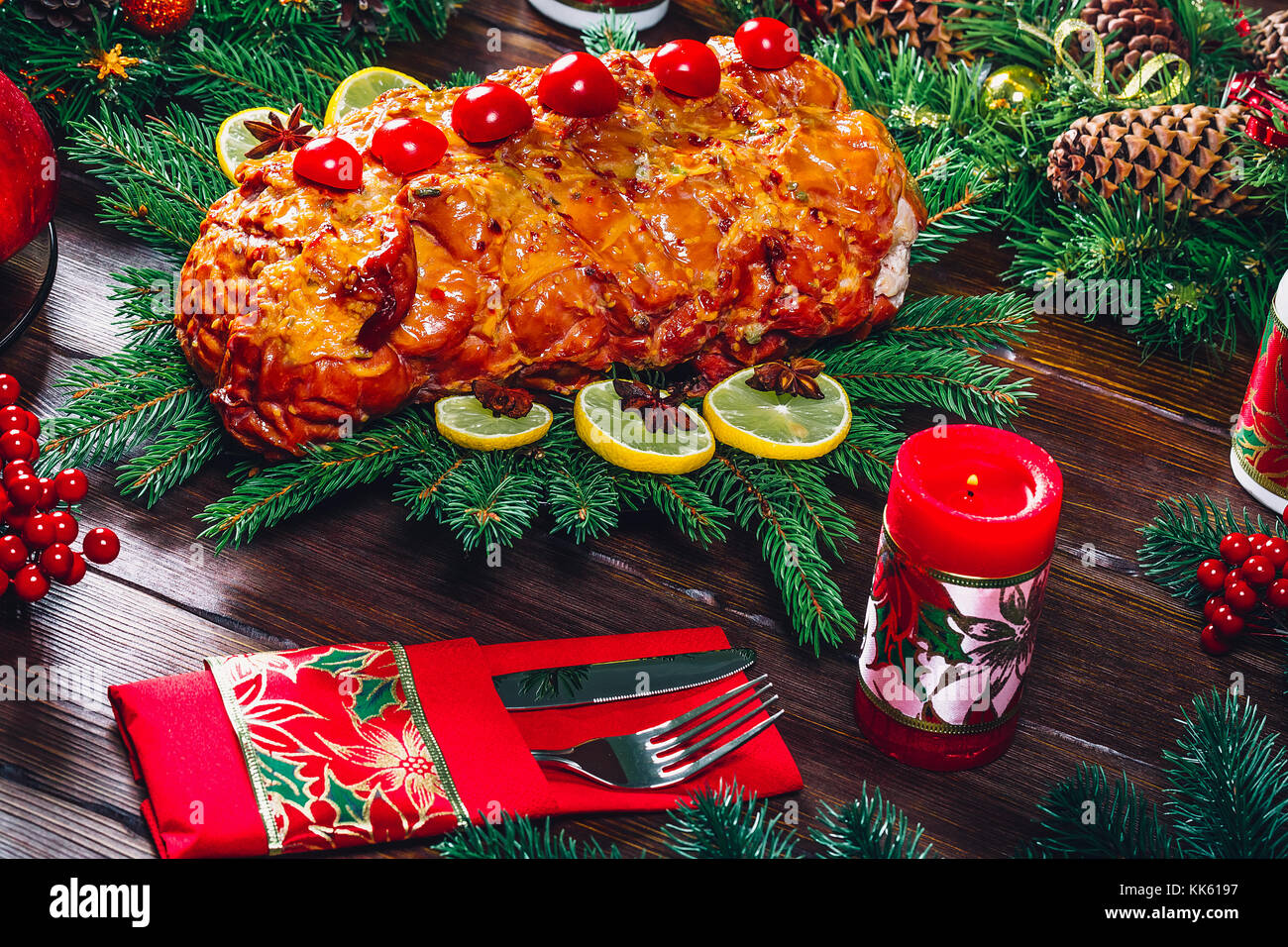 Christmas table dinner time with roasted meats, candles and New Year ...