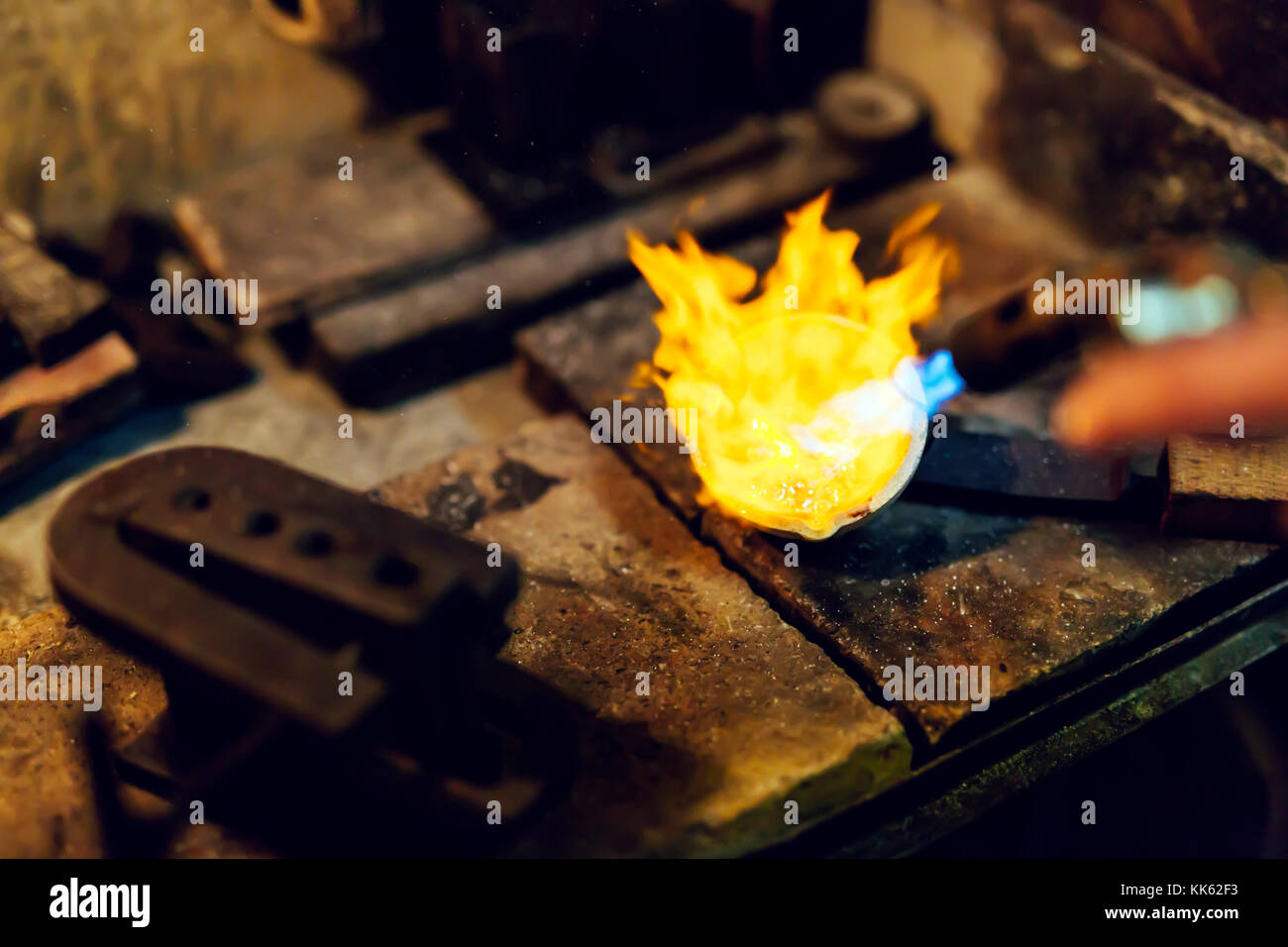 Jeweler welding gold Stock Photo - Alamy