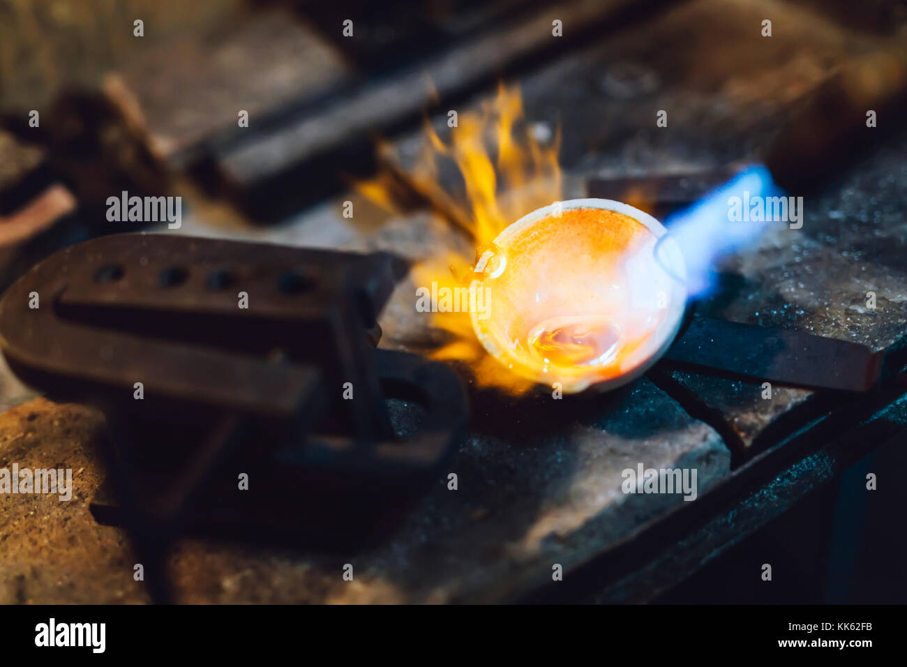 Jeweler welding gold Stock Photo - Alamy