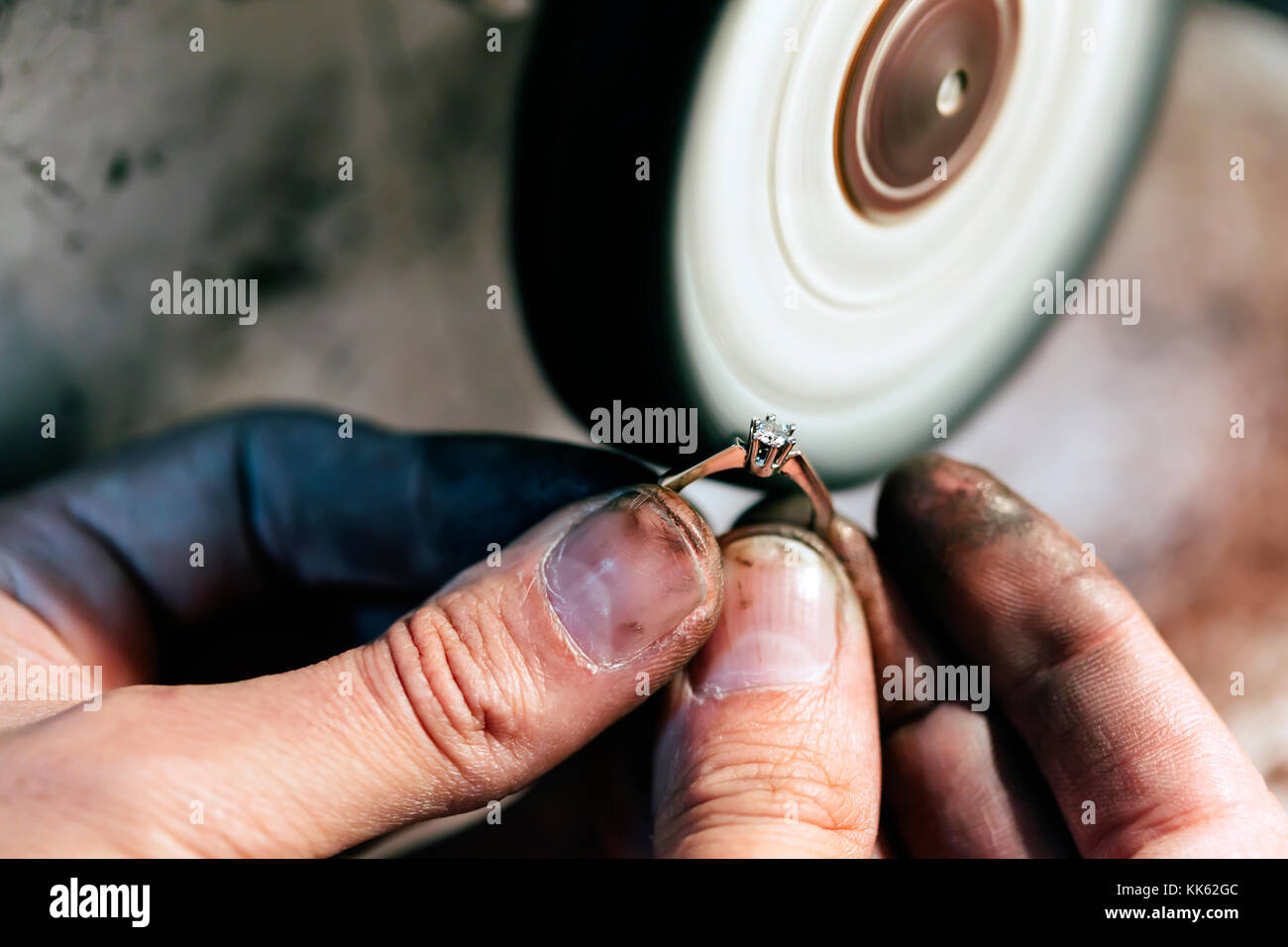 Jeweler polishing jewelry Stock Photo - Alamy