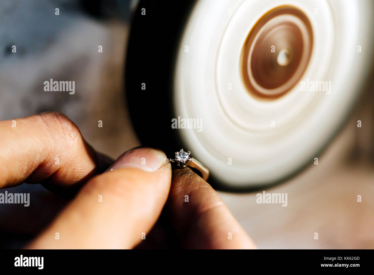 Jeweler polishing jewelry Stock Photo - Alamy