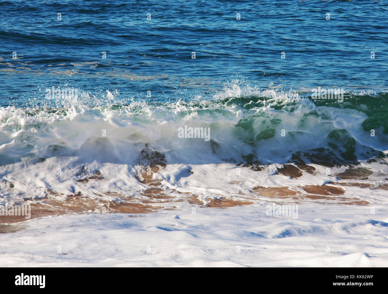 Wave on the beach Stock Photo - Alamy