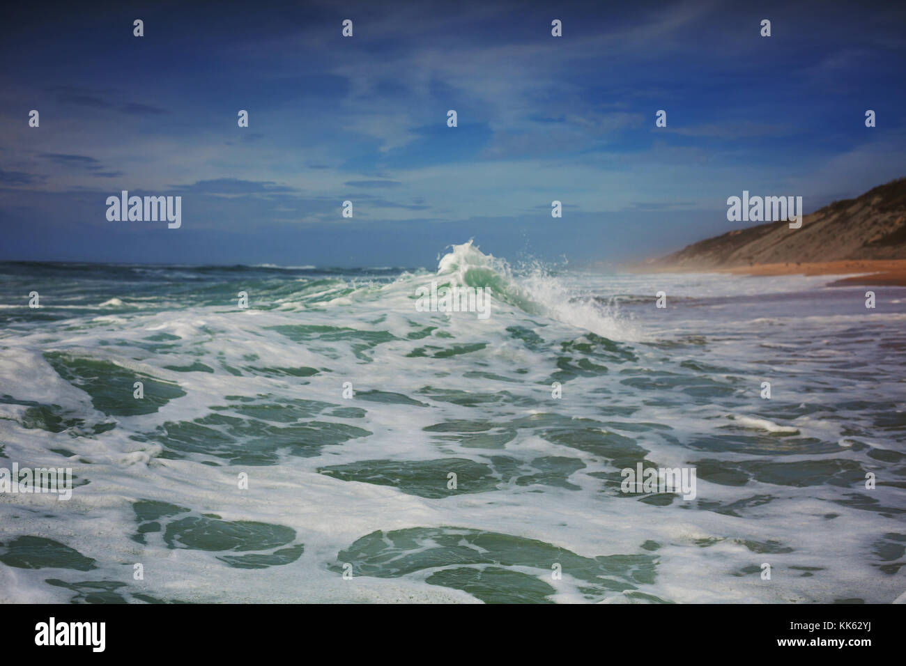 Wave on the beach Stock Photo - Alamy