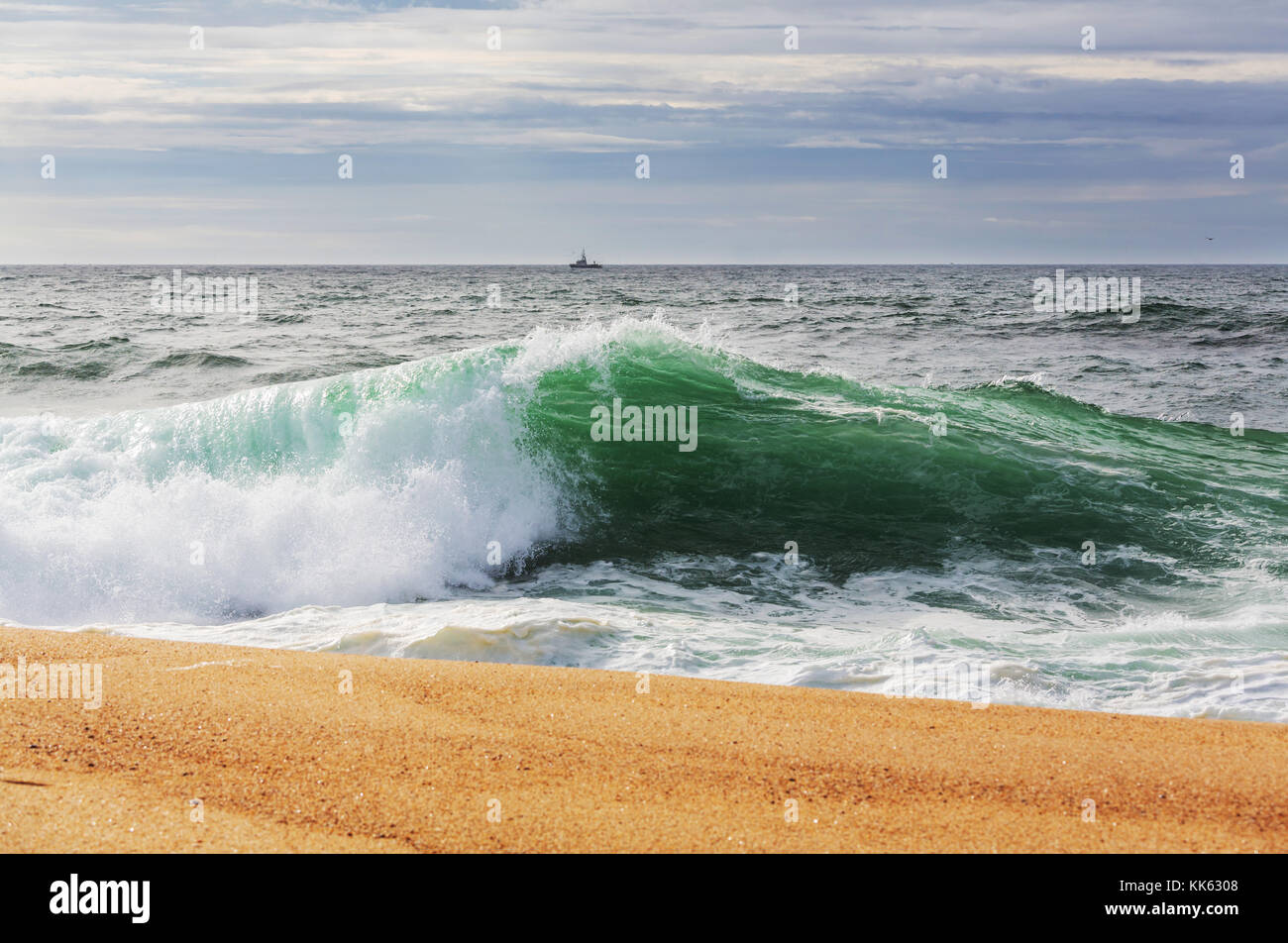 Wave on the beach Stock Photo - Alamy
