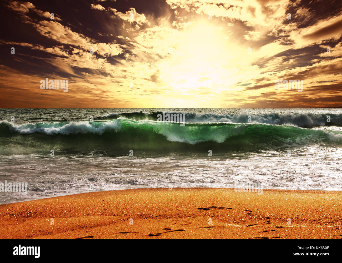 Wave on the beach Stock Photo - Alamy