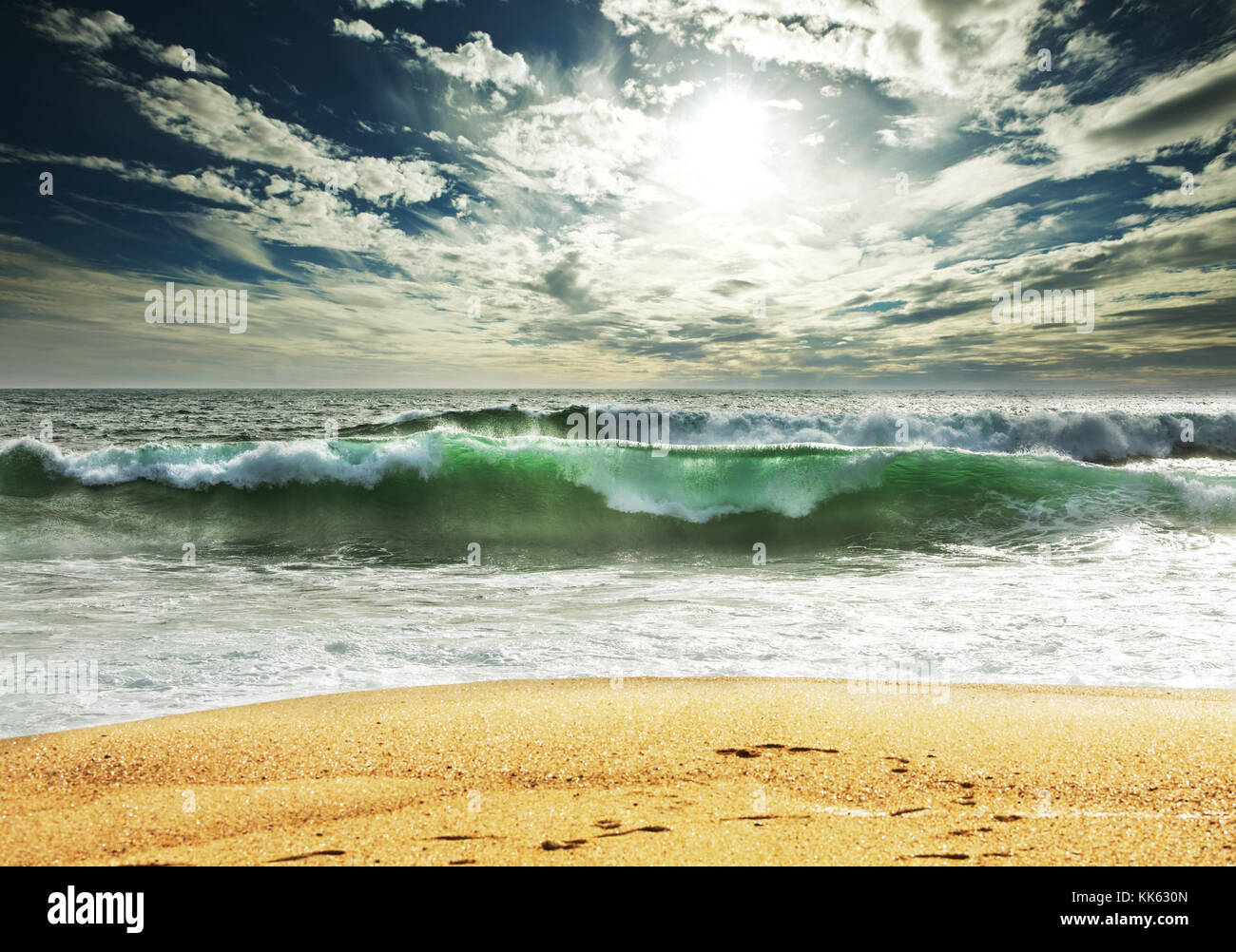 Wave on the beach Stock Photo - Alamy