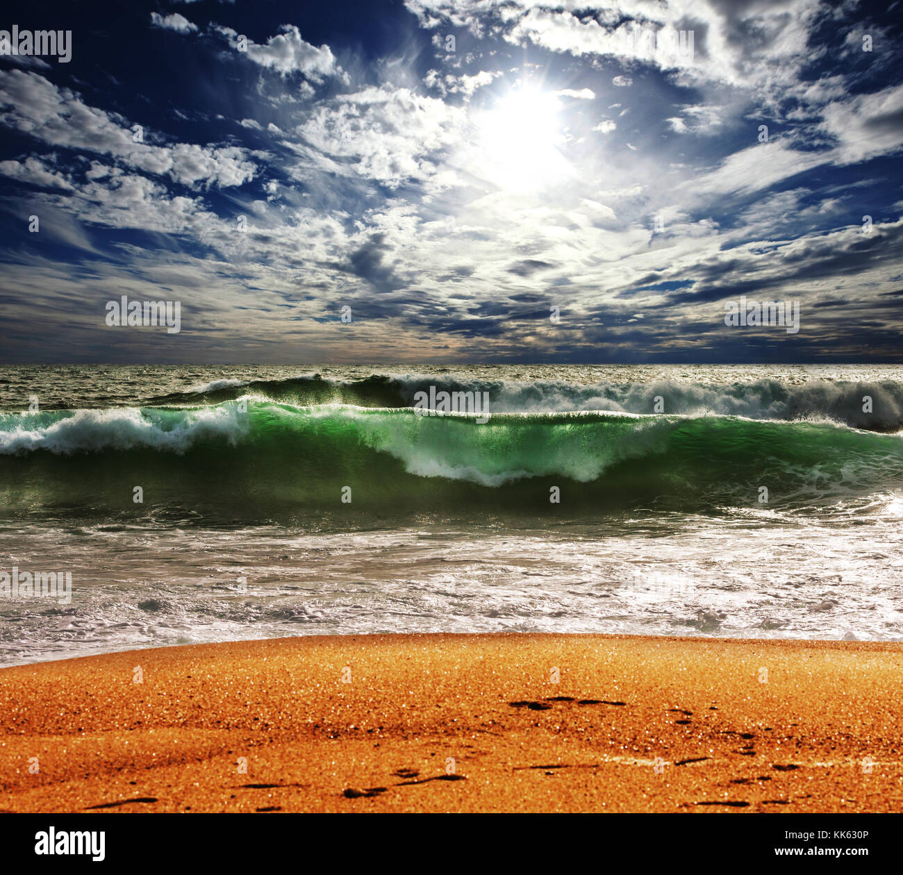 Wave on the beach Stock Photo - Alamy
