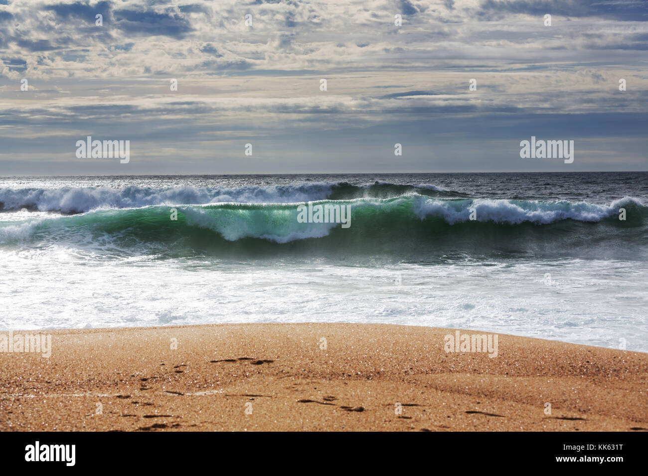 Wave on the beach Stock Photo - Alamy