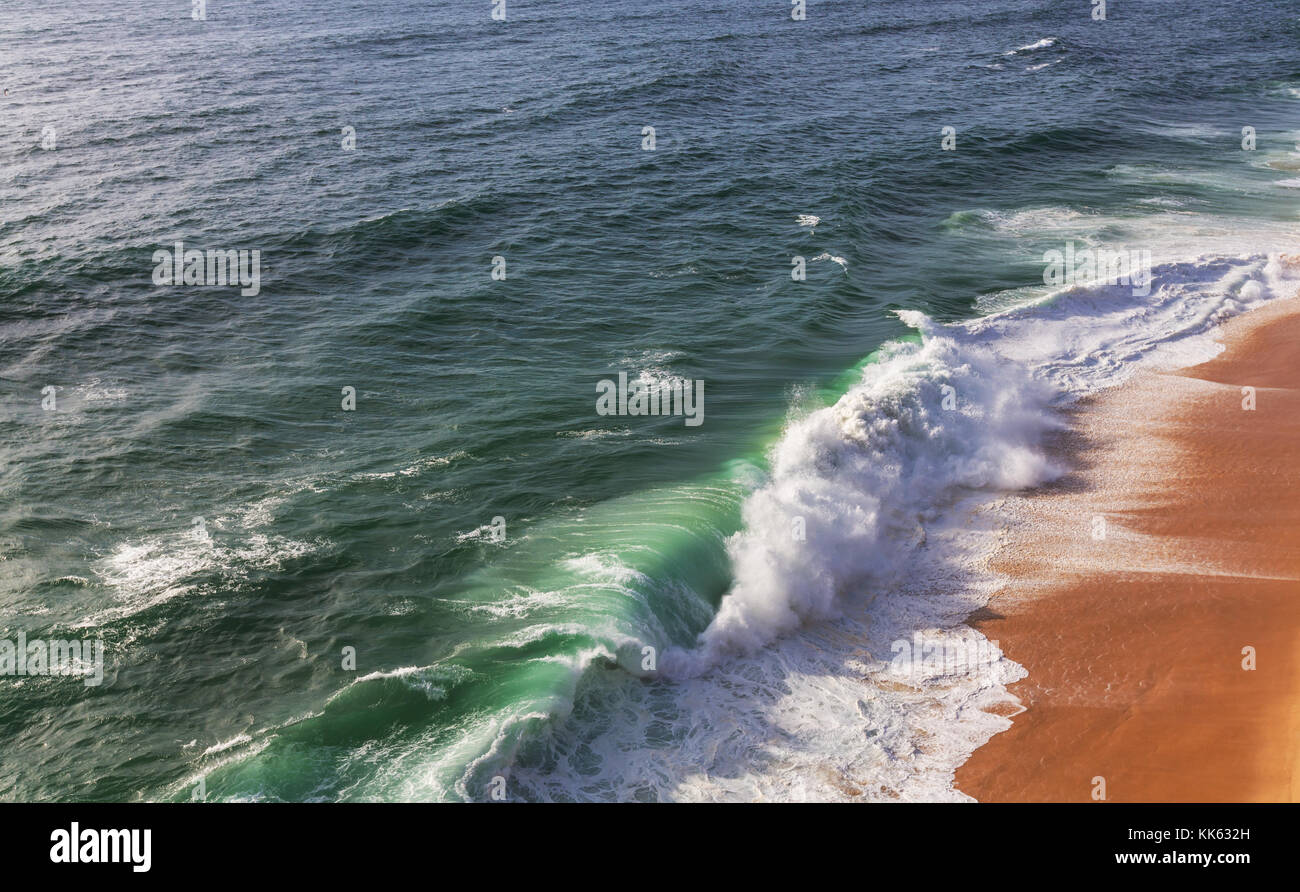 Wave on the beach Stock Photo - Alamy