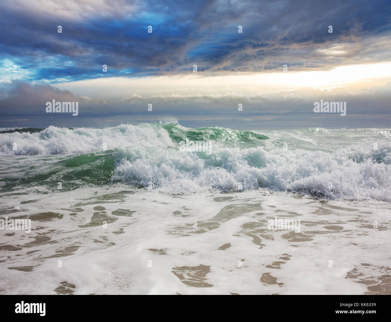 Wave on the beach Stock Photo - Alamy