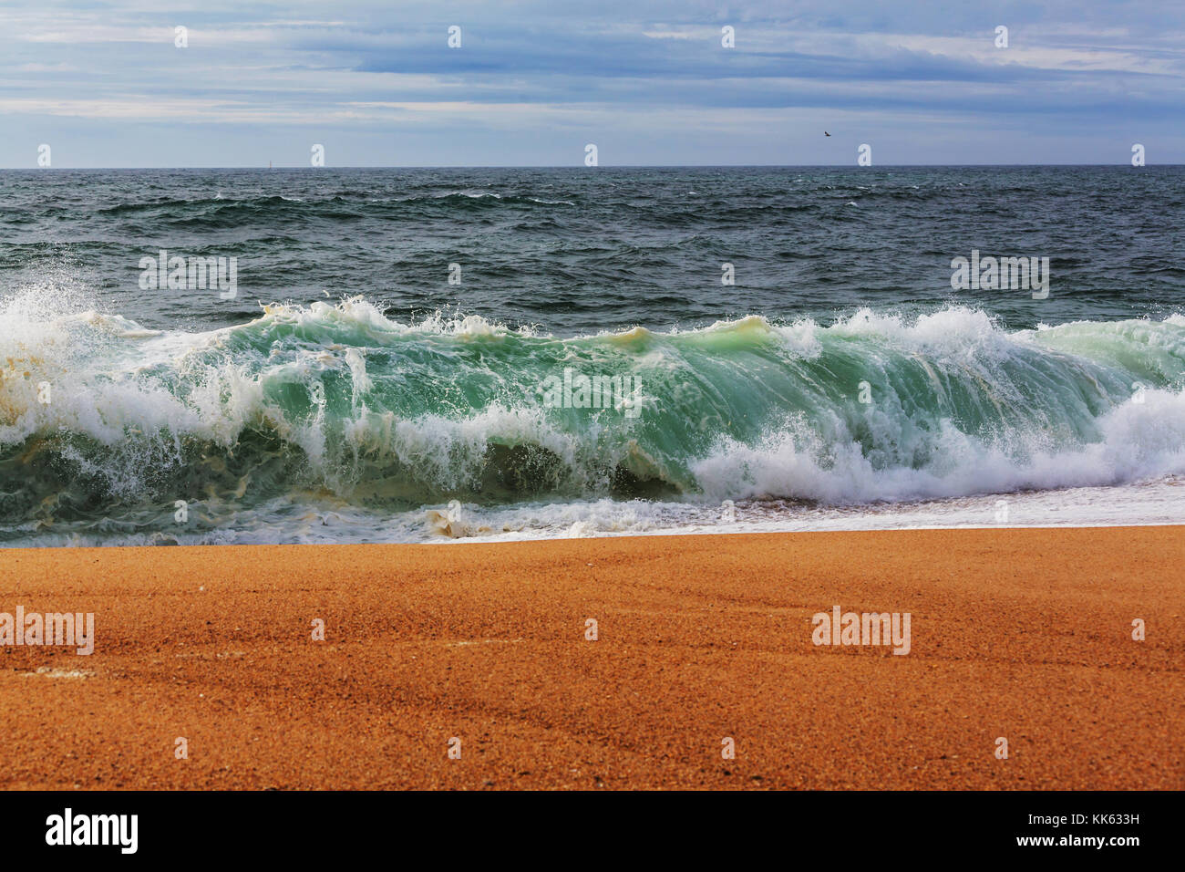 Wave on the beach Stock Photo - Alamy