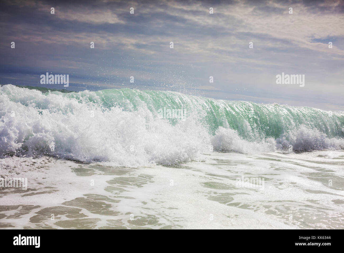 Wave on the beach Stock Photo - Alamy