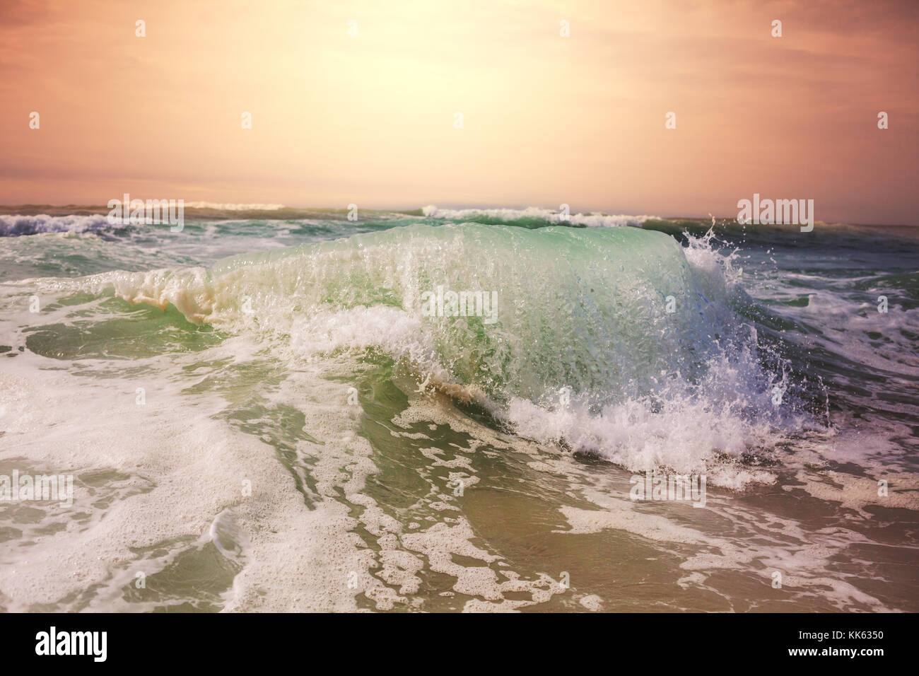 Wave on the beach Stock Photo - Alamy