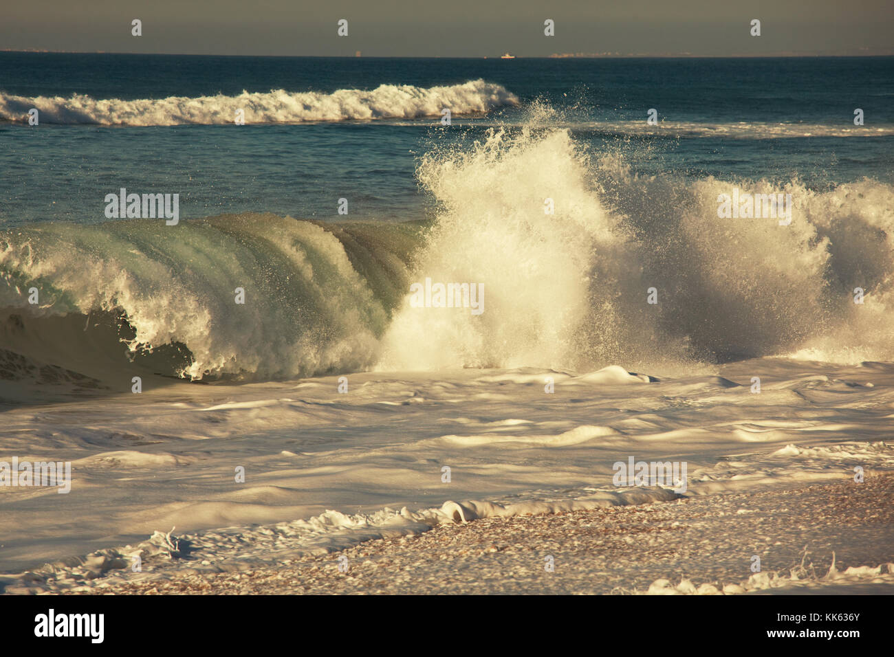 Wave on the beach Stock Photo - Alamy