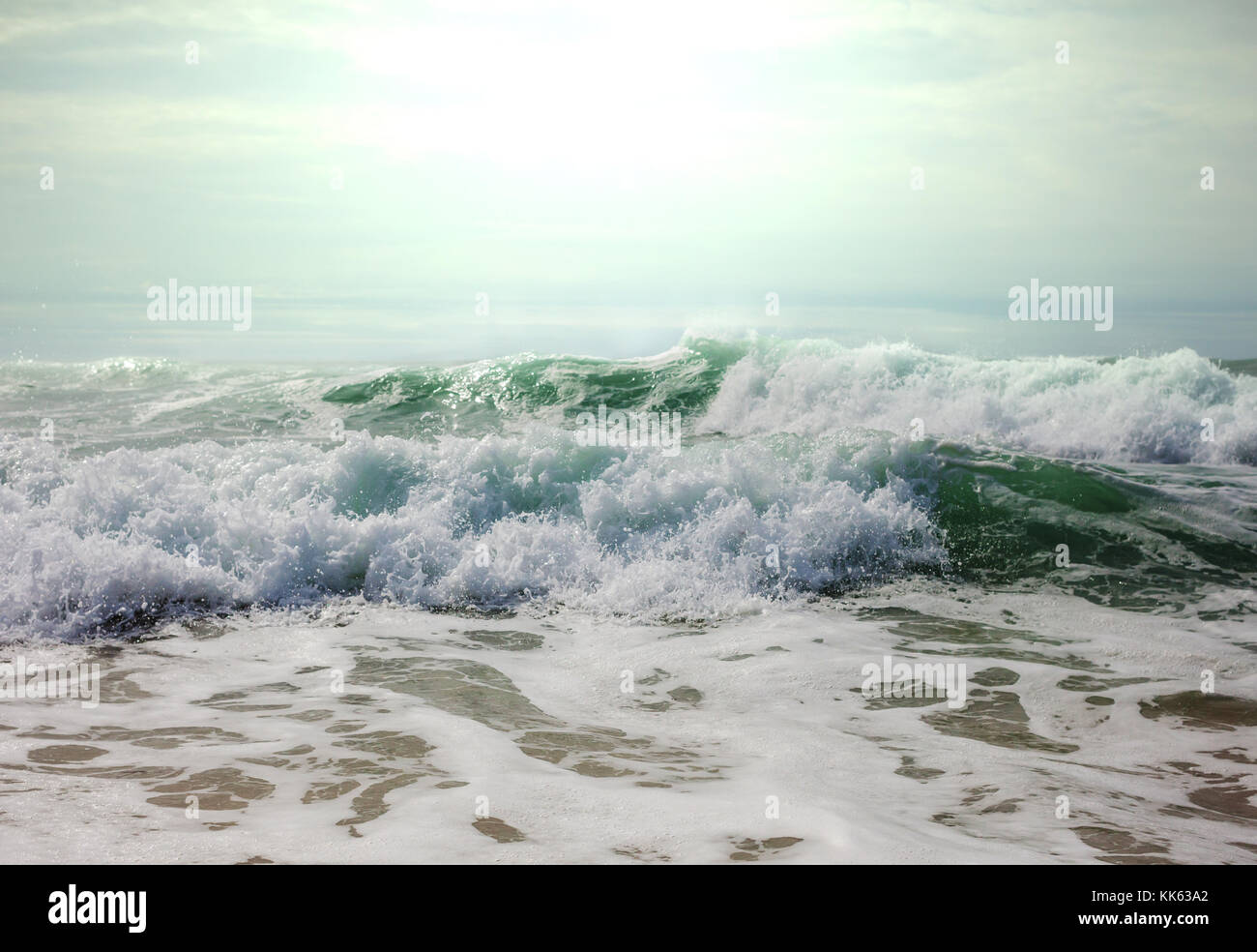 Wave on the beach Stock Photo - Alamy