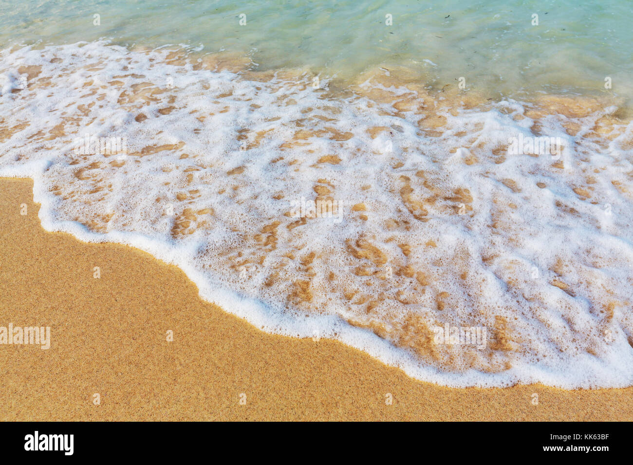 Wave on the beach Stock Photo - Alamy