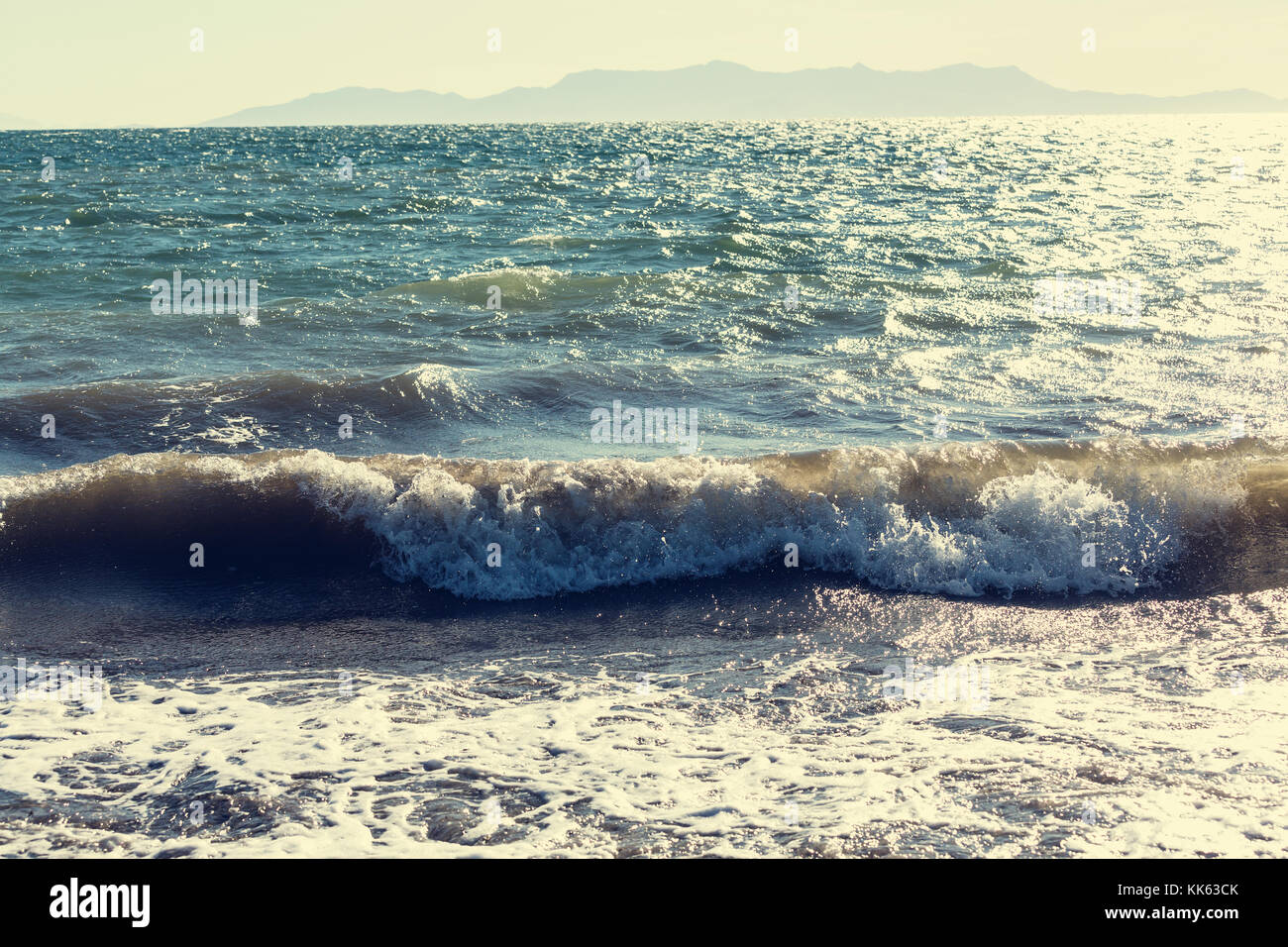 Wave on the beach Stock Photo - Alamy