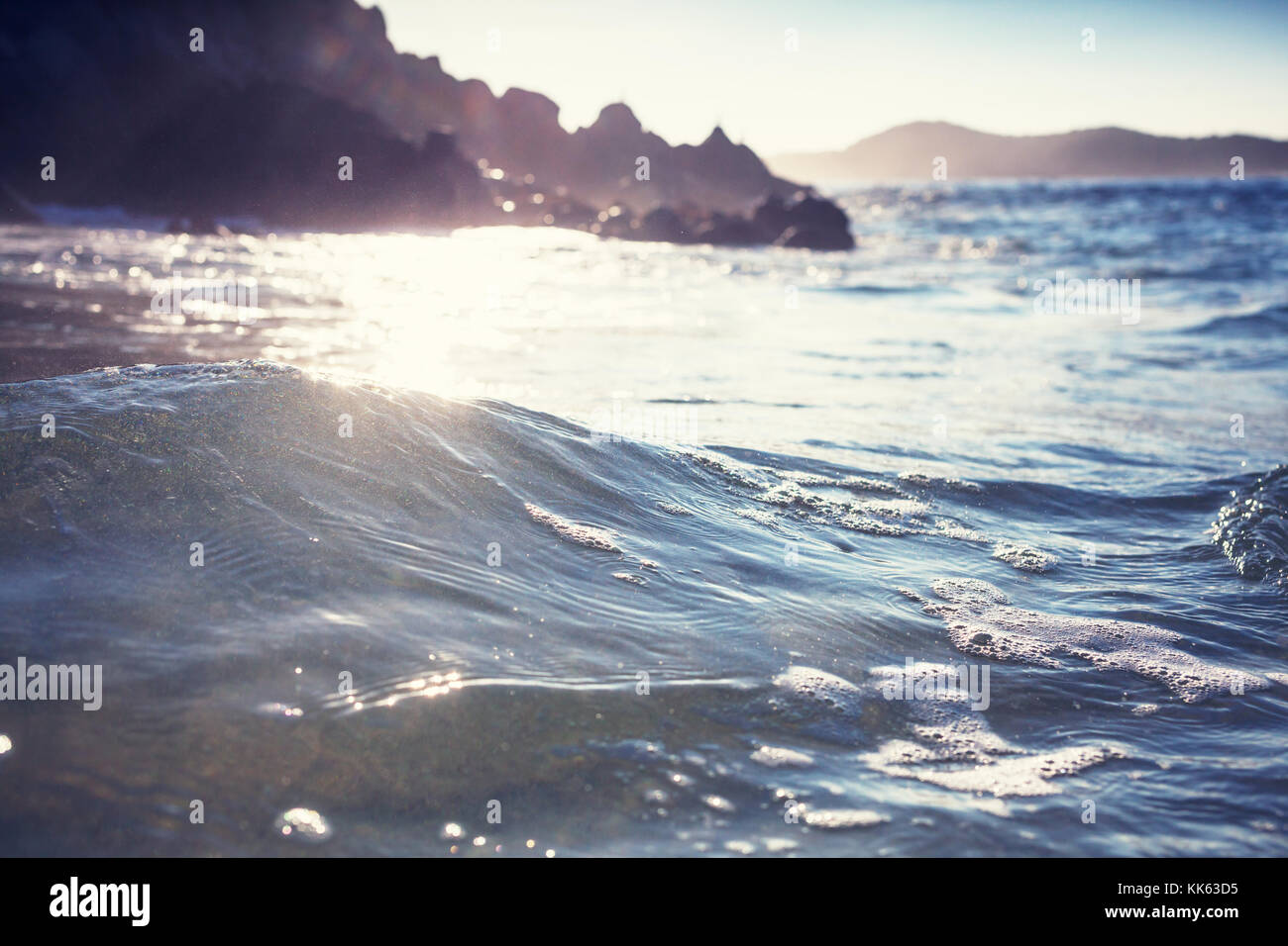 Wave on the beach Stock Photo - Alamy