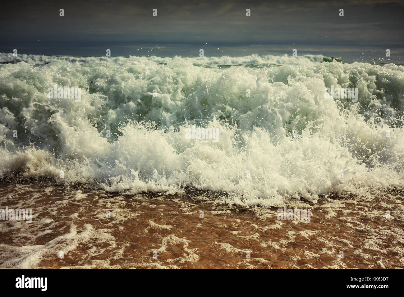 Wave on the beach Stock Photo - Alamy