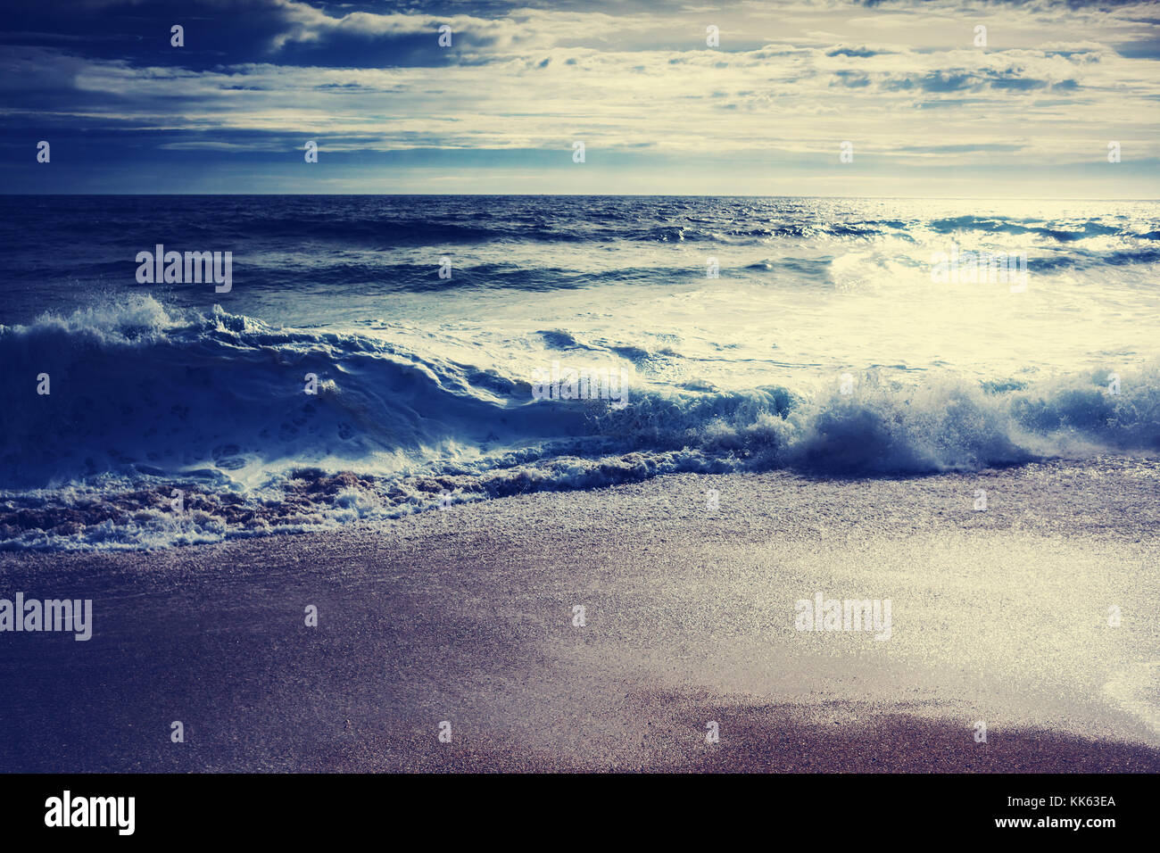 Wave on the beach Stock Photo - Alamy