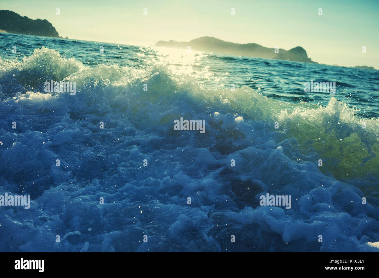 Wave on the beach Stock Photo - Alamy