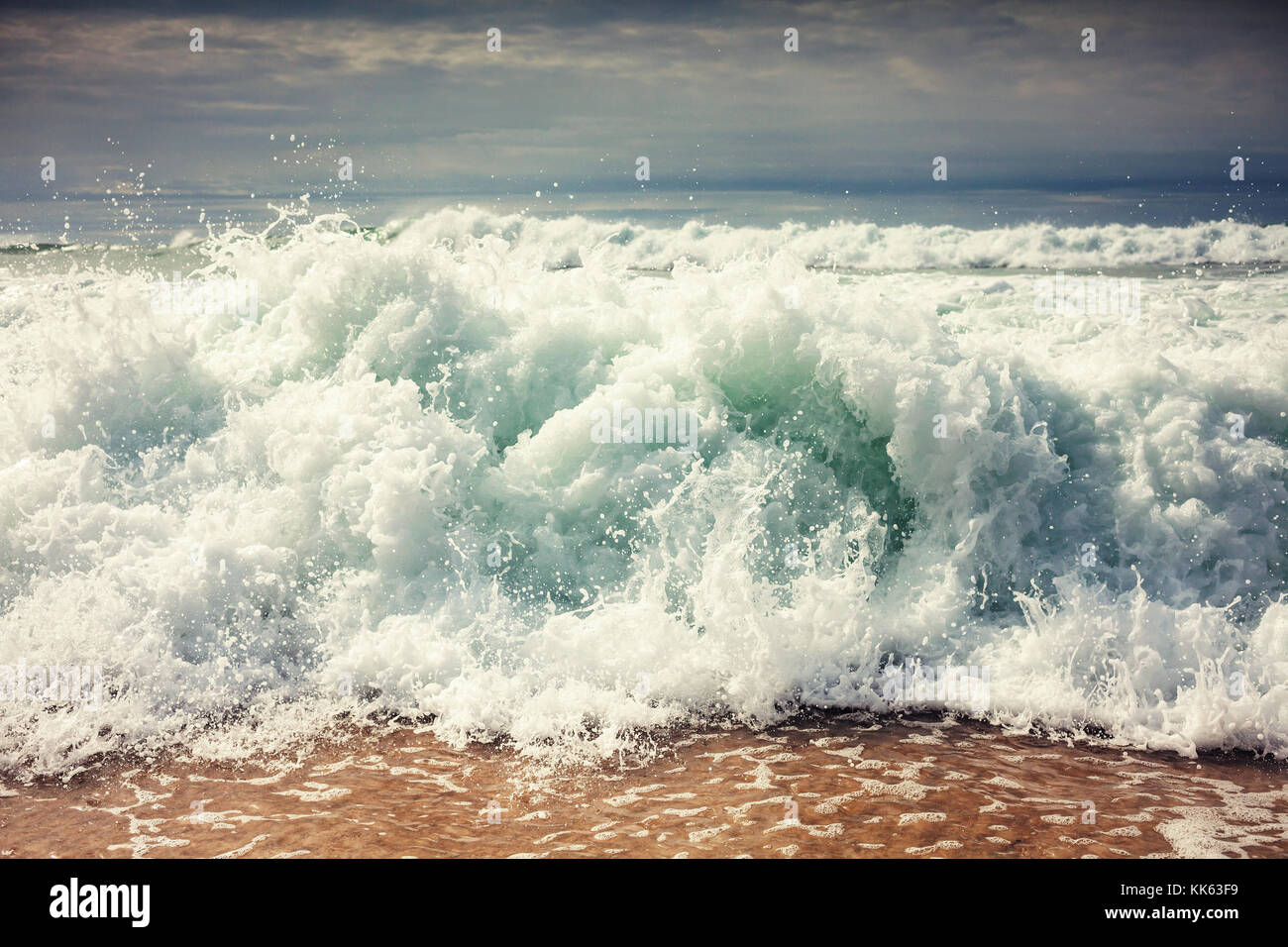The wave on the beach Stock Photo - Alamy