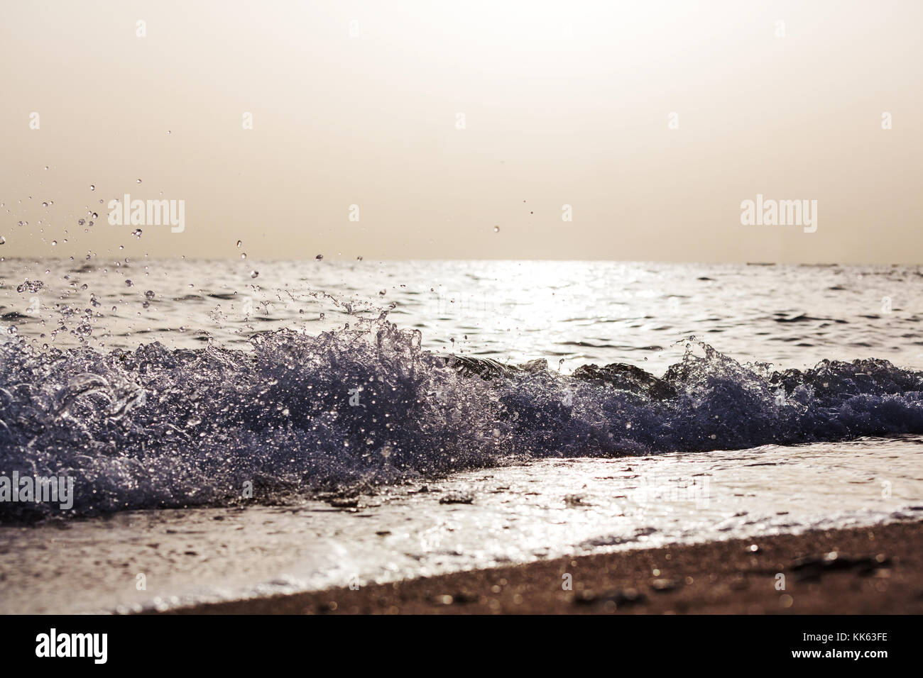 The wave on the beach Stock Photo - Alamy