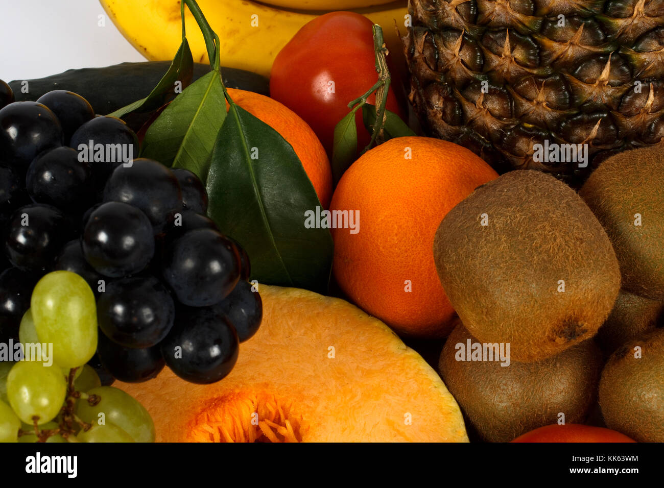 Detail of multi colored vegetables and fruit isolated on white ...