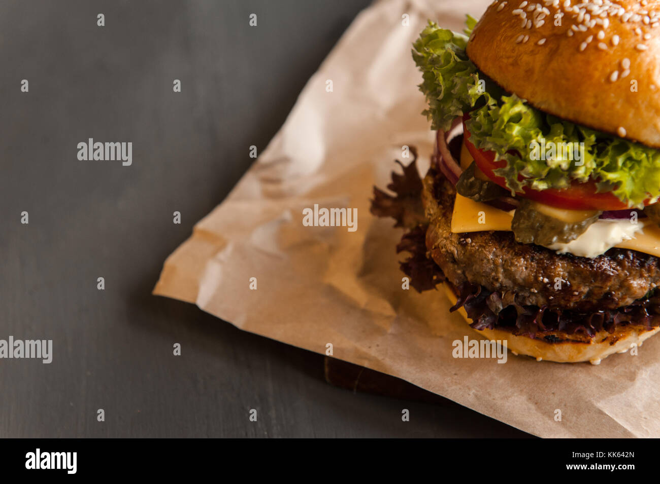 Delicious fresh homemade burger on a wooden table Stock Photo - Alamy