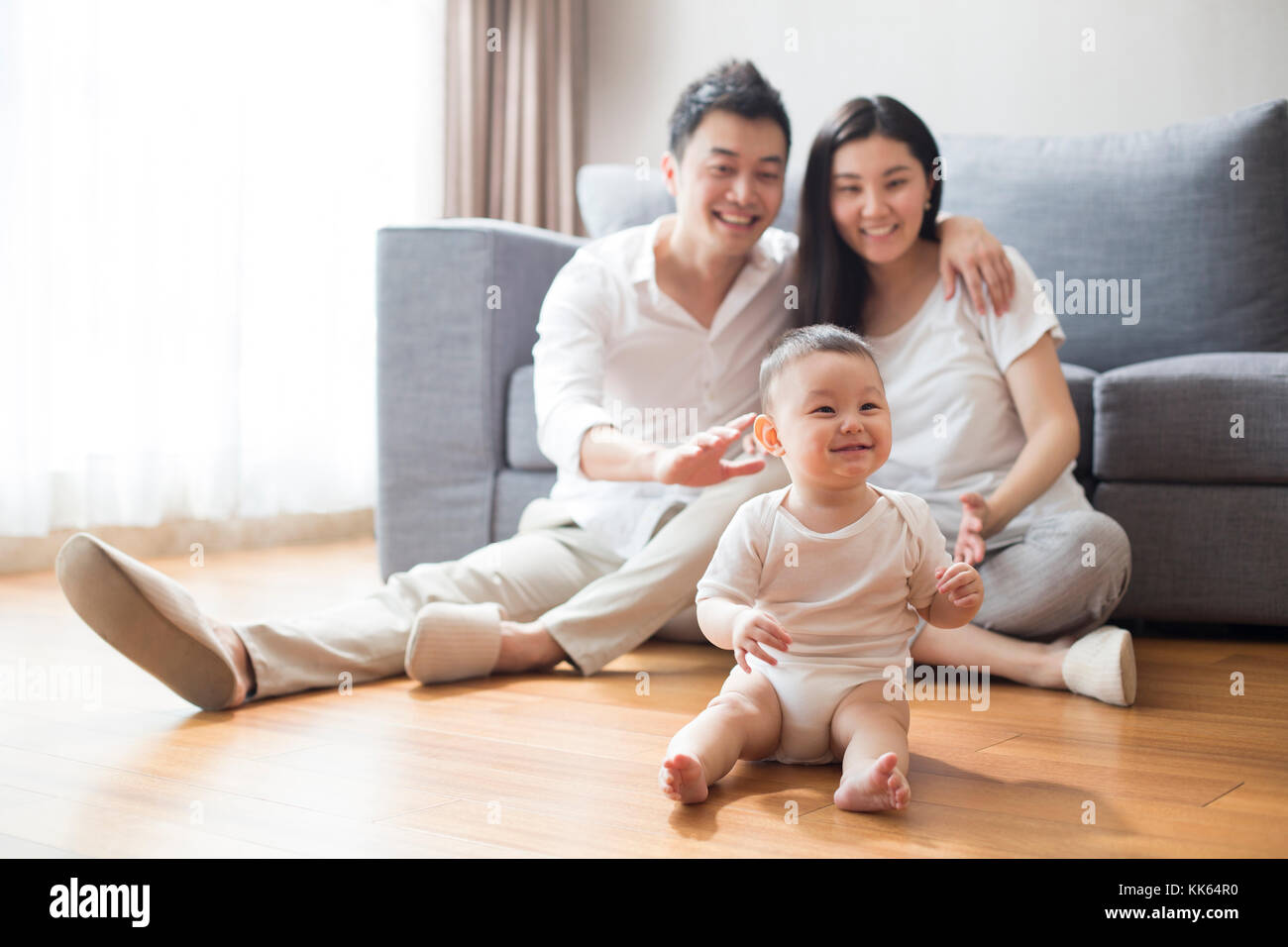 Happy young Chinese family Stock Photo - Alamy