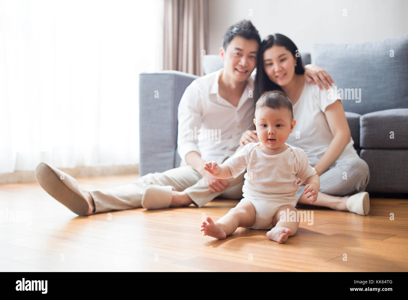 Happy young Chinese family Stock Photo - Alamy