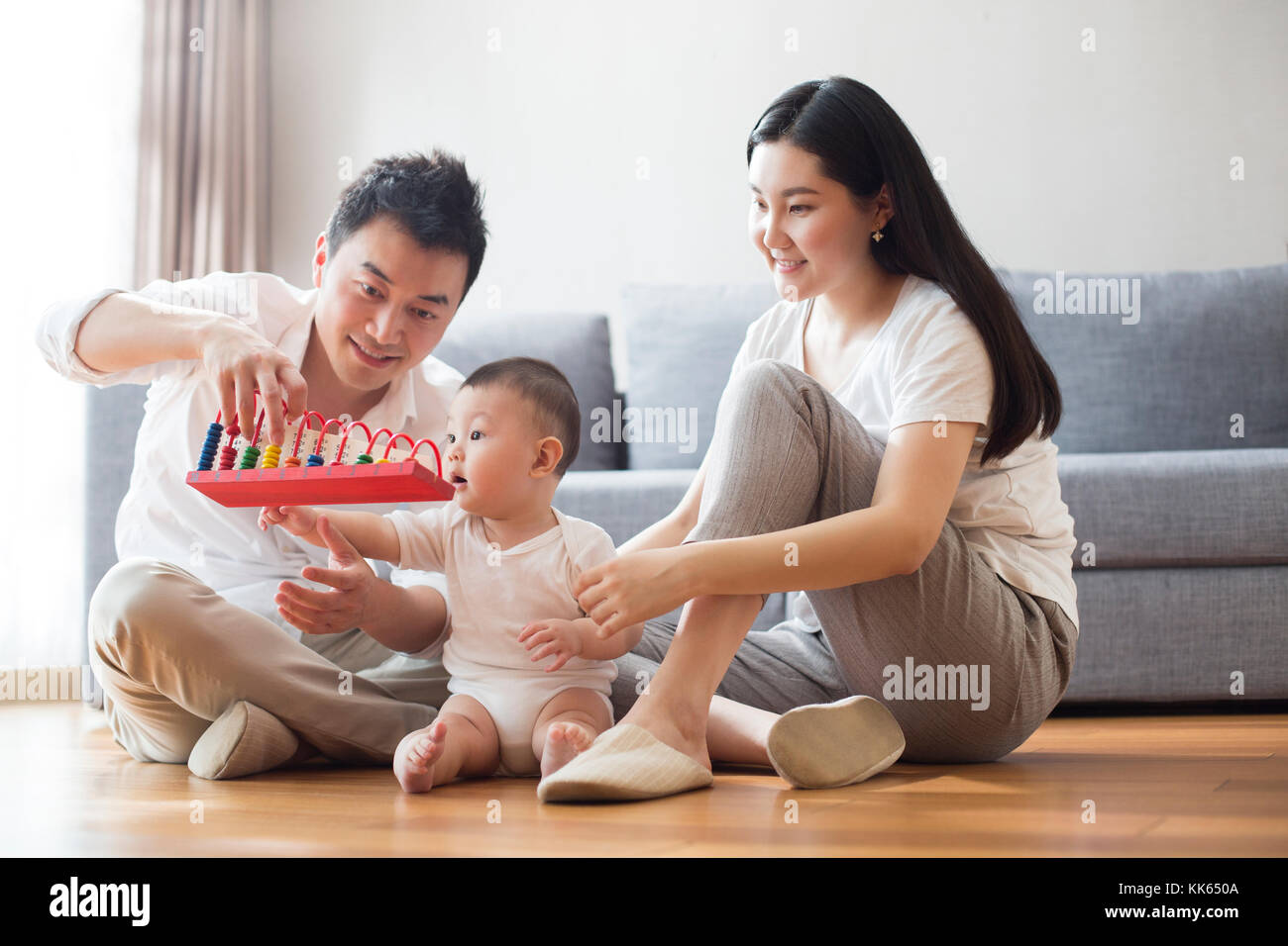 Happy young Chinese family Stock Photo - Alamy