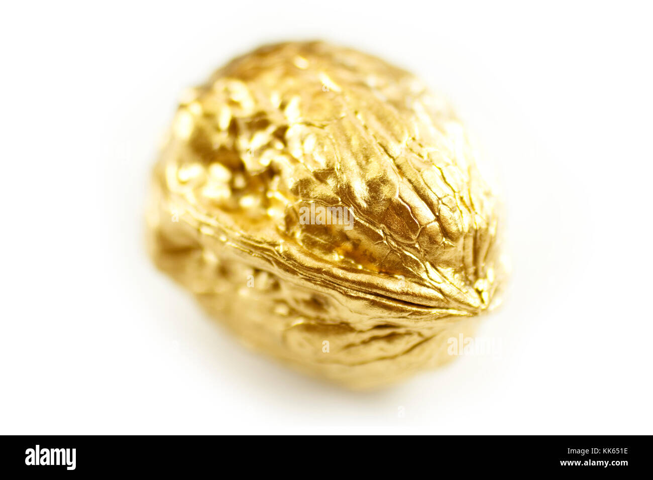 Golden nut isolated on white background Stock Photo - Alamy