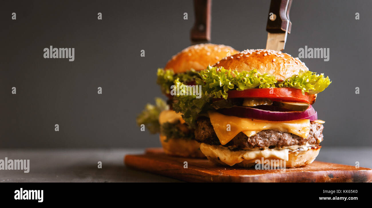 Two mouth-watering, delicious homemade burger used to chop beef. on the ...