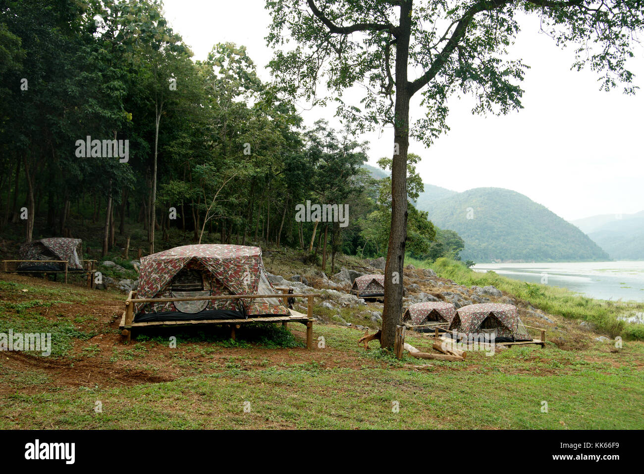 beautiful landscape, camping tents at outdoor camp site near the river ...