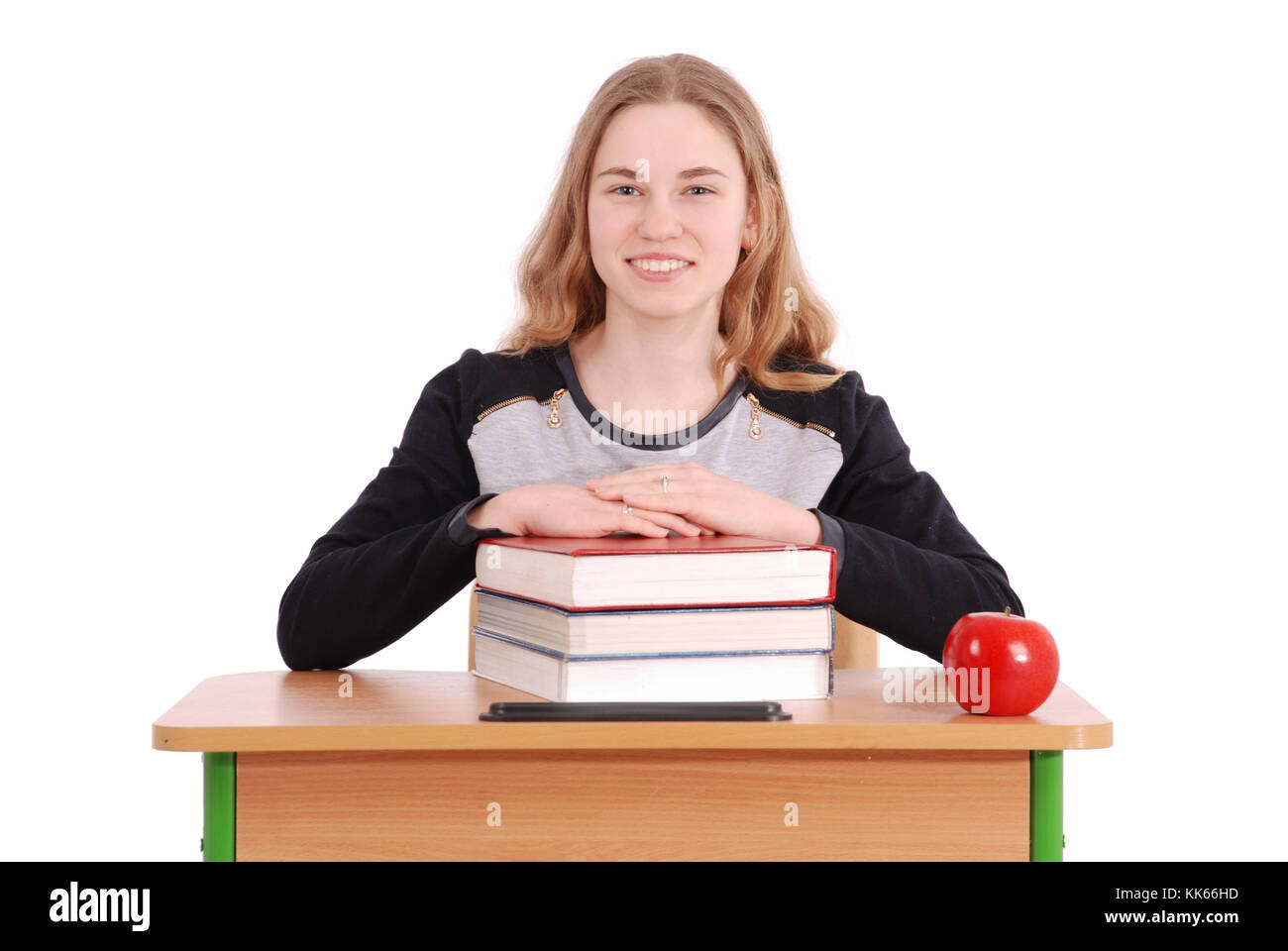 School girl sitting at a desk isolated on white Stock Photo - Alamy