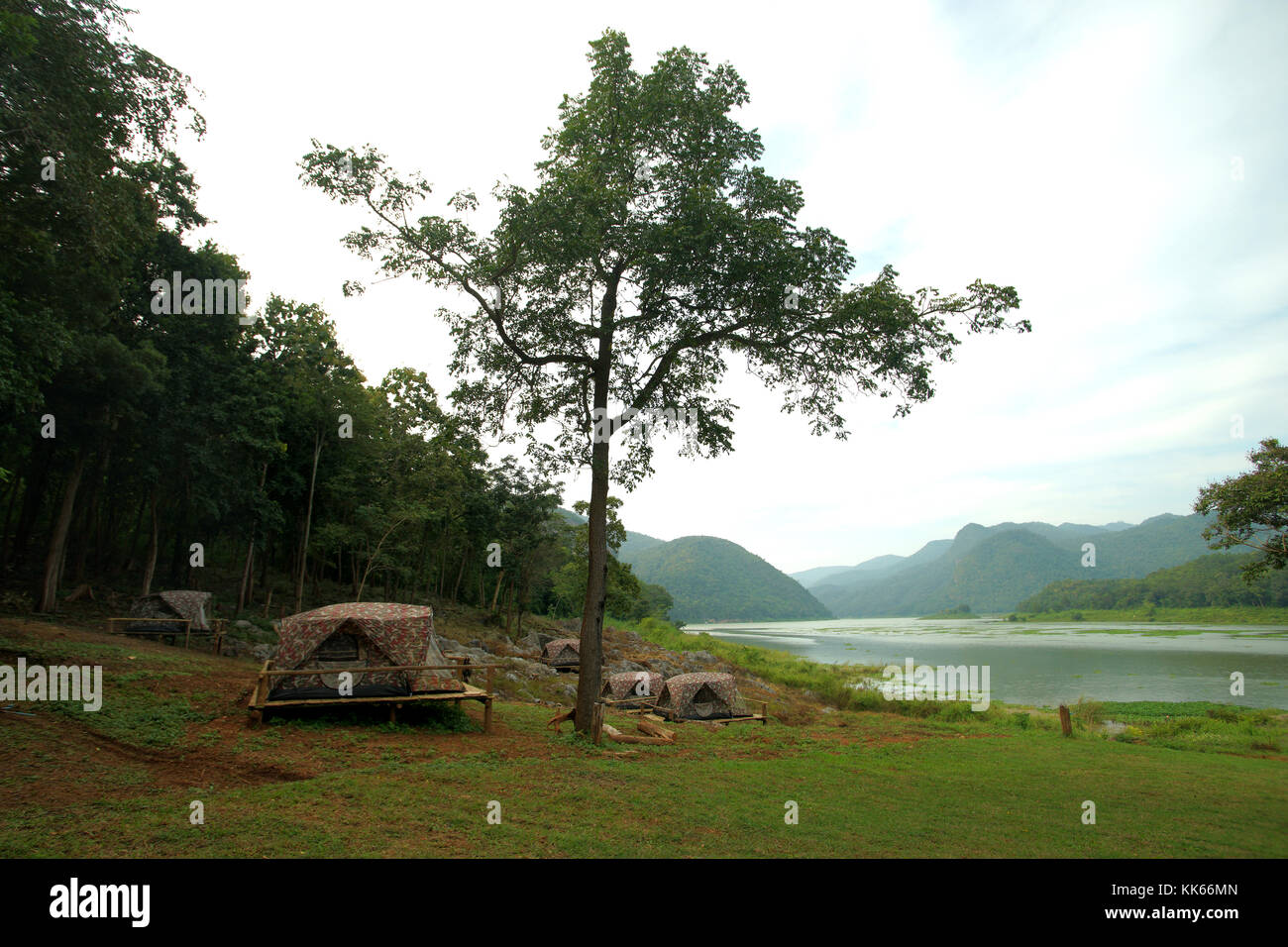 beautiful landscape, camping tents at outdoor camp site near the river ...