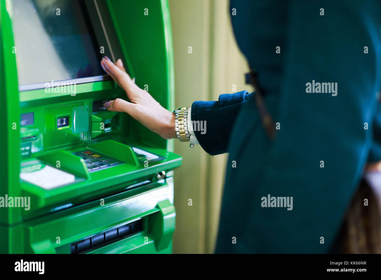 Fingers on cash machine hi-res stock photography and images - Alamy