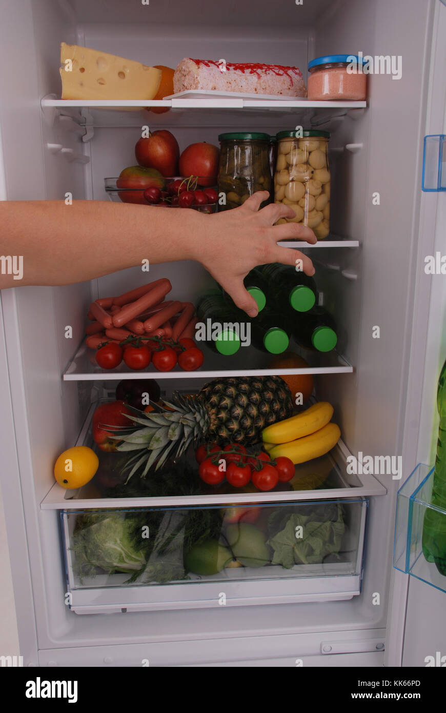 Male hand picking food from refrigerator. Full of Healthy Food Options ...