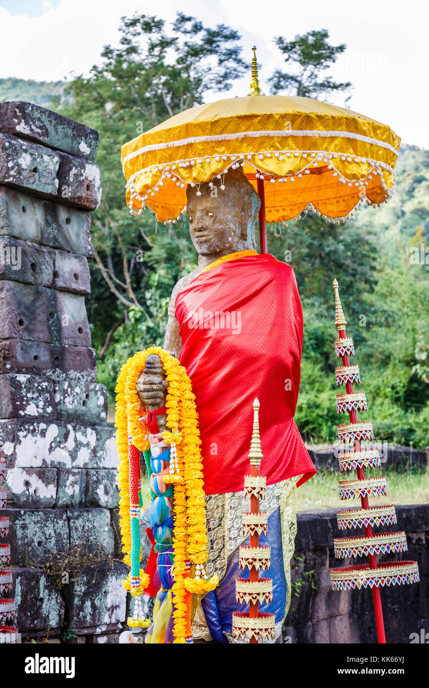 Statue of Khmer Dvarapala, founder of Wat Phou, in the ruins of the pre ...