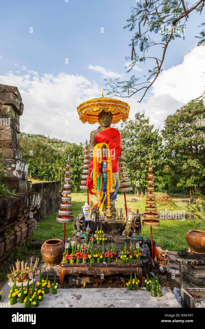 Statue of Khmer Dvarapala, founder of Wat Phou, in the ruins of the pre ...