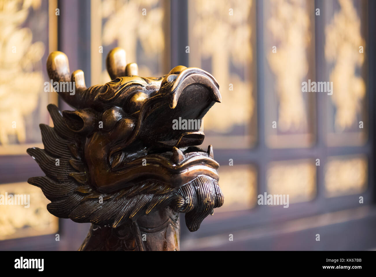 Golden color dragon head scultpure Stock Photo - Alamy