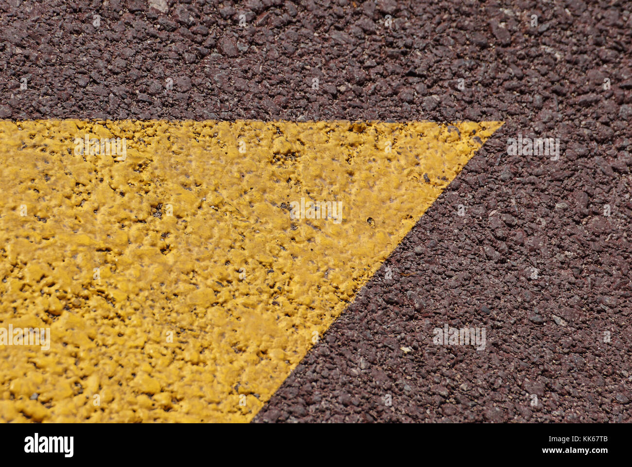 Asphalt background texture with some fine grain with Yellow Stripe ...