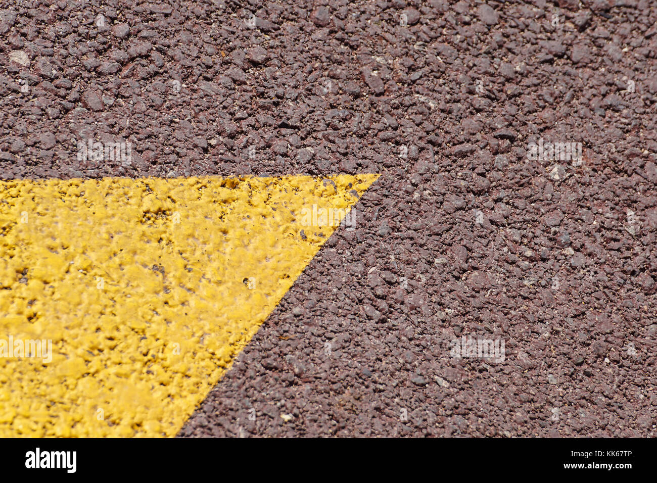 Asphalt background texture with some fine grain with Yellow Stripe ...