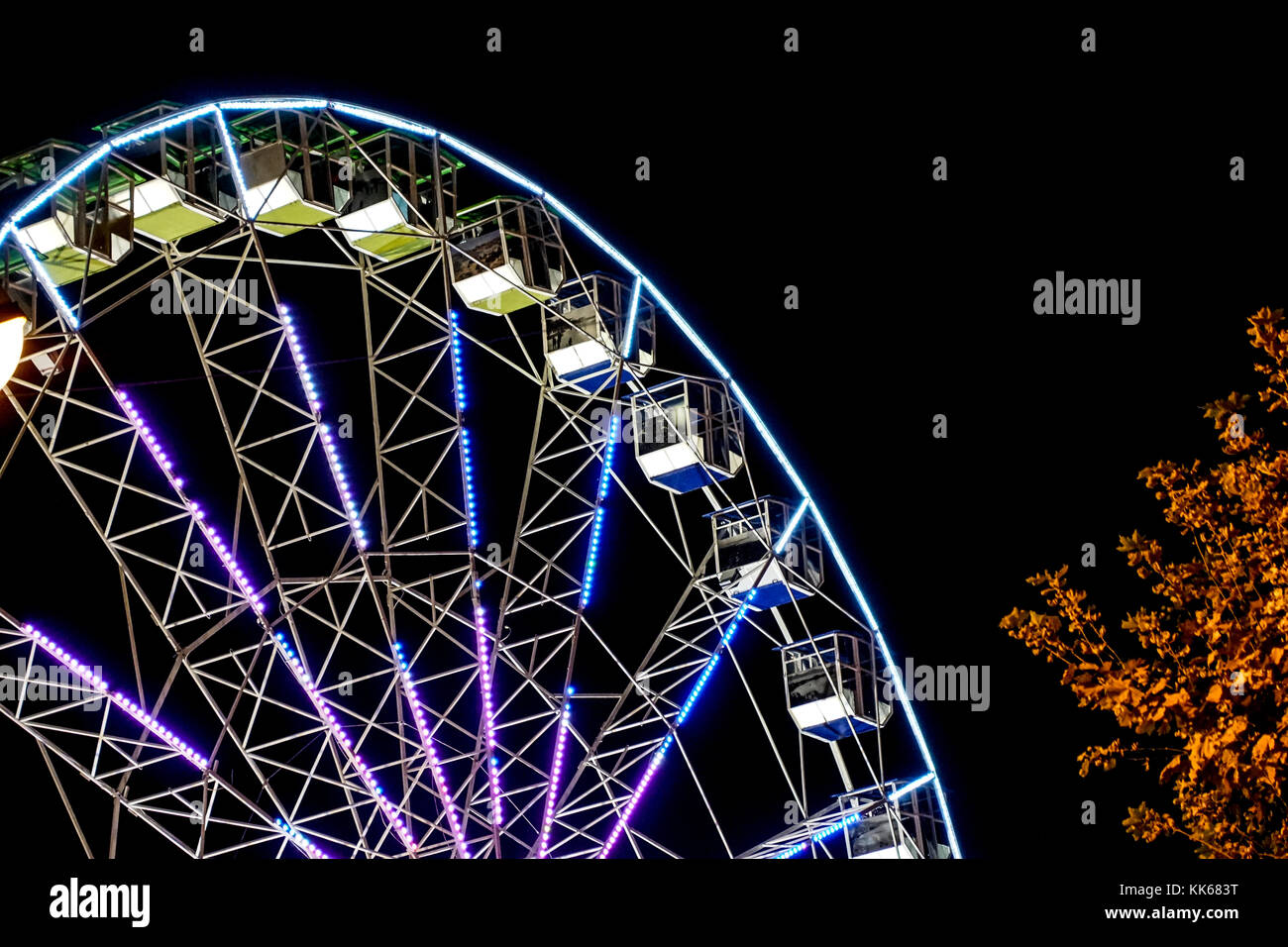 detail of a night-time panorama wheel lit by lights Stock Photo - Alamy