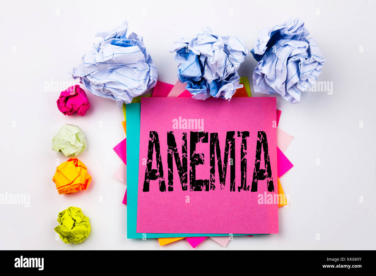 Writing text showing Anemia written on sticky note in office with screw ...