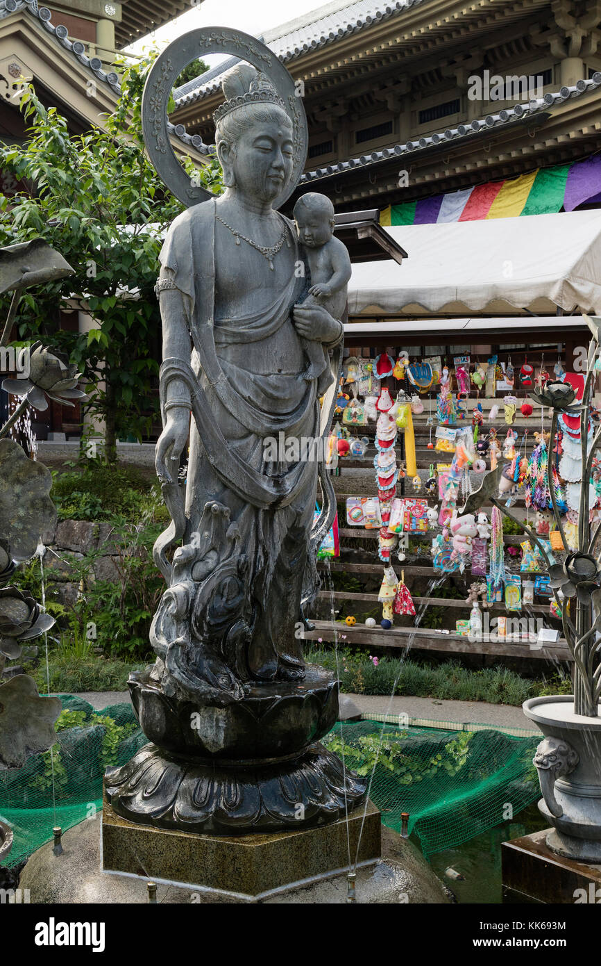 Nagano, Japan - June 3, 2017: Traditional stone carved Buddhist statue ...