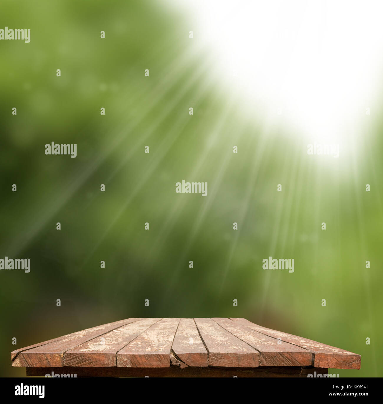 Empty wooden table with garden Stock Photo - Alamy
