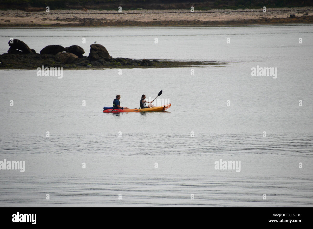 A Man and Woman Paddling a Kayak in Green Bay on Bryher Island in the ...